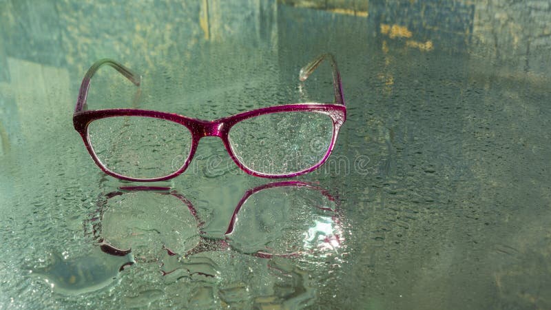 Wet glasses on wet ground stock photo. Image of glasses - 121973582