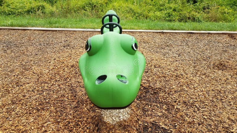 Wet Green Playground Equipment or Ride at Park Stock Image - Image of ...