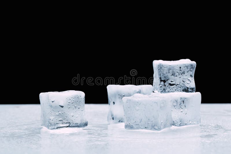 Wet Ice Cubes with Drops on a Dark Black Background Stock Image - Image ...