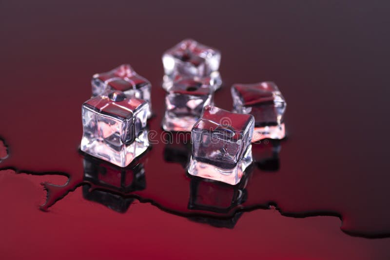 Wet Ice Cubes in a Puddle of Water on a Red Background Stock Photo ...