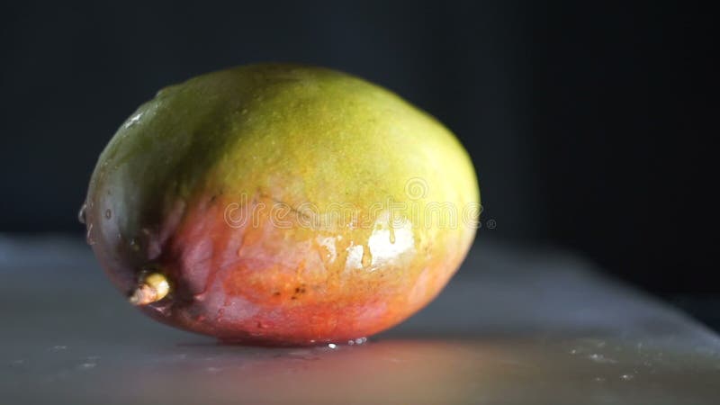 Wet Mango with Water Dripping on it Stock Video - Video of droplet ...