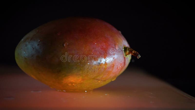 Wet Mango with Water Dripping on it Stock Video - Video of droplet ...