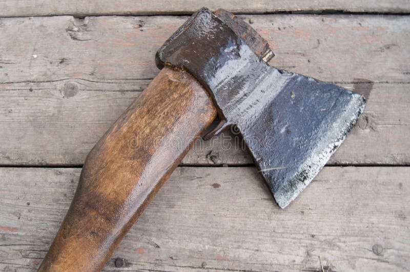 Wet Old Axe Lying on a Dark Wooden Surface Stock Image - Image of ...