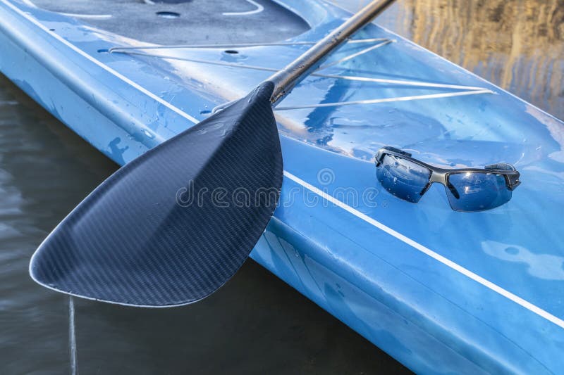 Paddle and Sunglasses on a Deck of Stand Up Paddleboard Stock Image ...