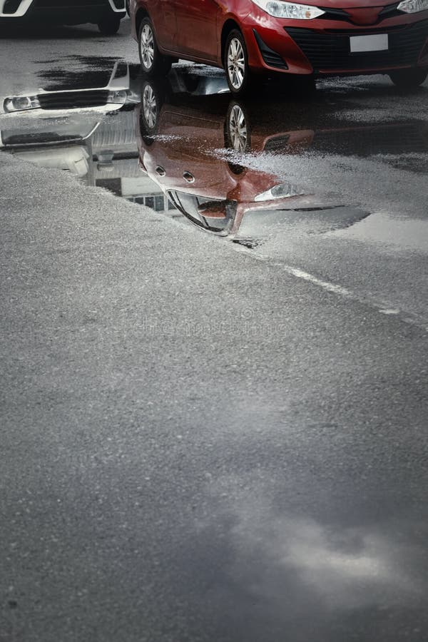 Wet Parking Spaces after Hard Rain Fall with Reflection in Puddle on ...