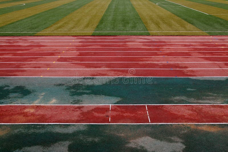 Wet Red Plastic Runway in a Sports Ground Stock Photo - Image of line ...