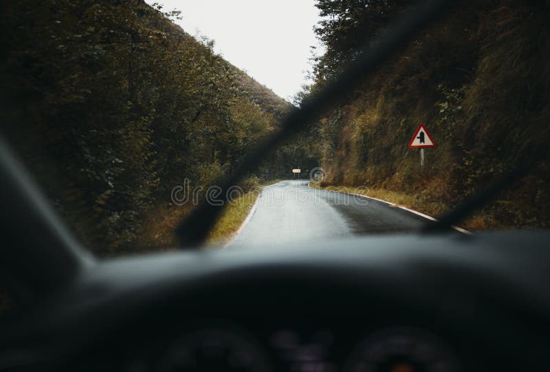 Wet Road View while Driving Car Across the Mountains Stock Image ...
