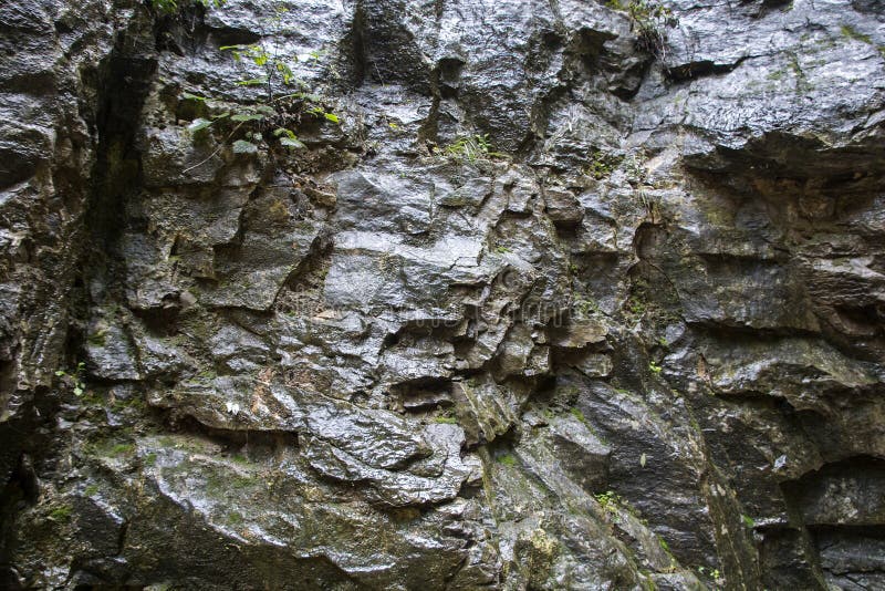 Wet rock surface stock photo. Image of reflective, rough - 78495004