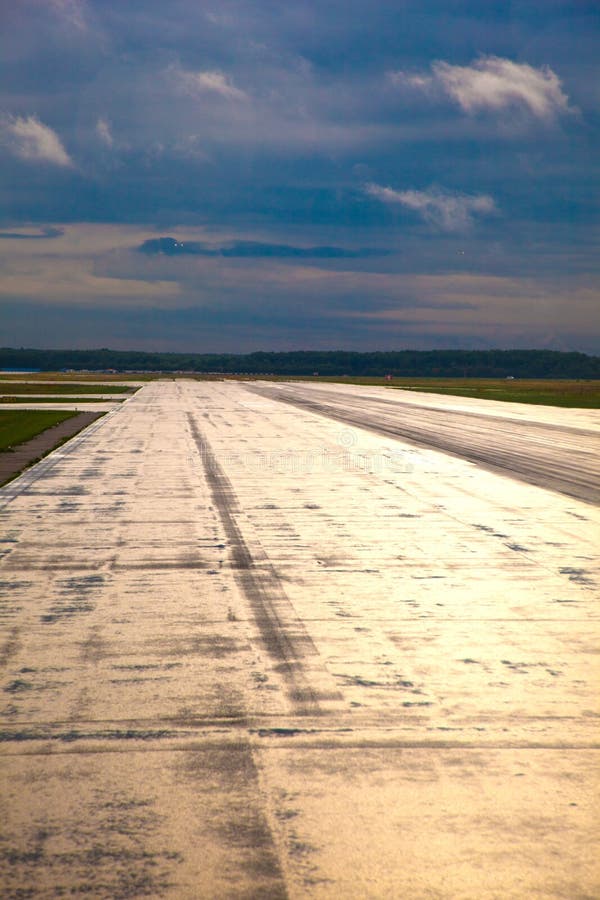 Wet runway early morning stock photo. Image of headlights - 55418804