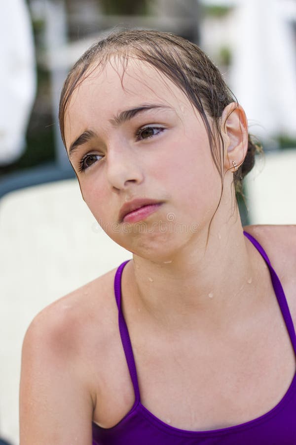 Beautiful Young Girl In A Purple Swimsuit On The Background Of A Stock