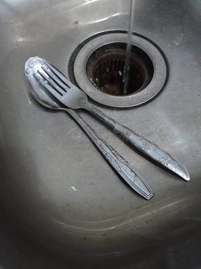 Wet Spoon and Fork in the Kitchen Sink Stock Photo - Image of sink ...