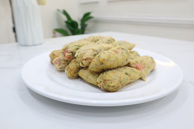 Wet Spring Rolls are Placed on a White Ceramic Plate Stock Photo ...