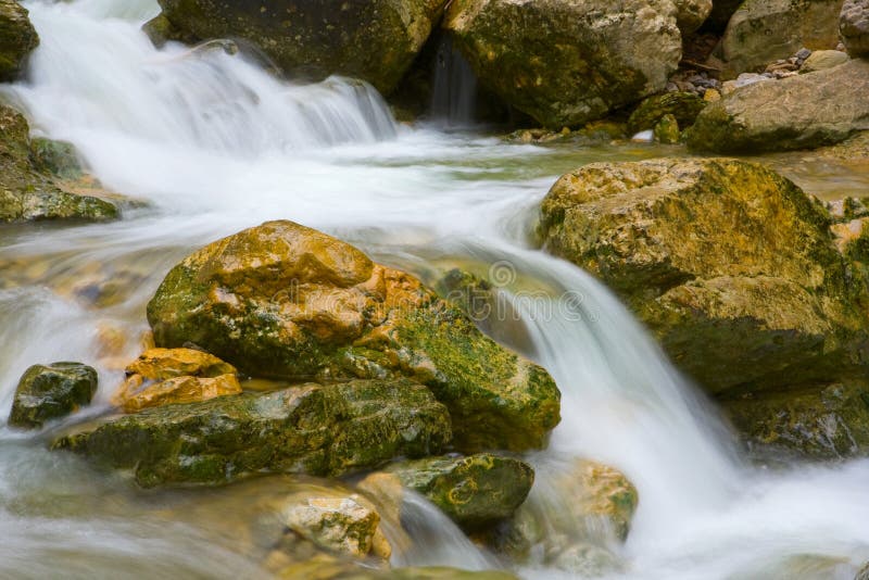 Wet stones in stream stock photo. Image of scenery, flowing - 20965654