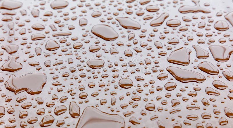 A Wet Surface with Many Small Water Droplets Scattered Across it Stock ...
