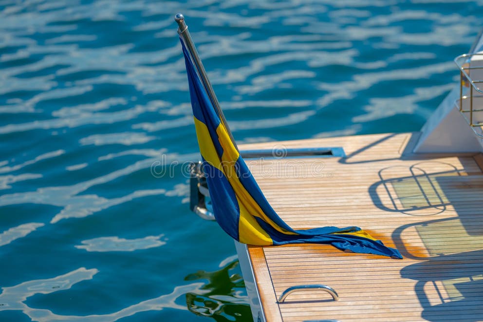 Wet Swedish Flag on the Bathing Platform of a Boat.. Stock Image ...