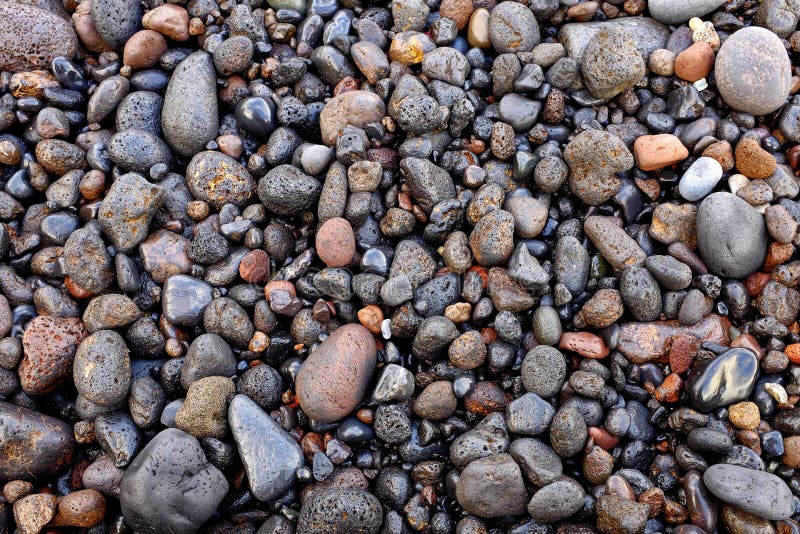 Wet volcanic pebbles stock image. Image of rocks, dark - 49253427