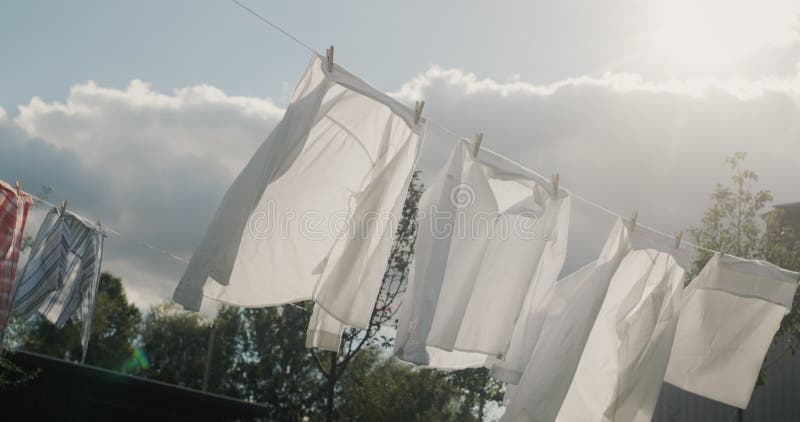 Wet Shirts To Dry on a Clothesline in the Wind Stock Video - Video of ...