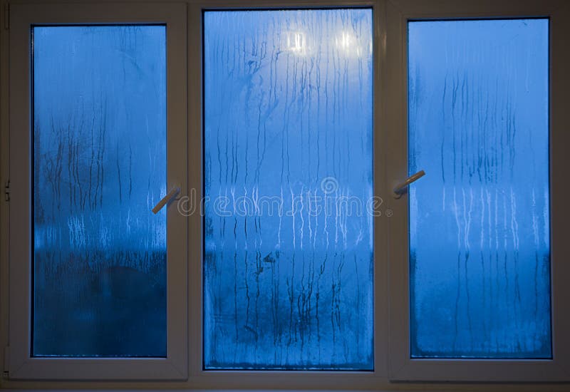 Wet Window in Winter from Heating. Drops of Water Flow and Leave Marks ...