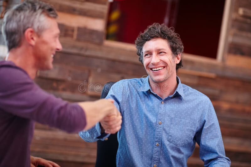 Weve Got a Deal. Two Coworkers Shaking Hands. Stock Image - Image of ...