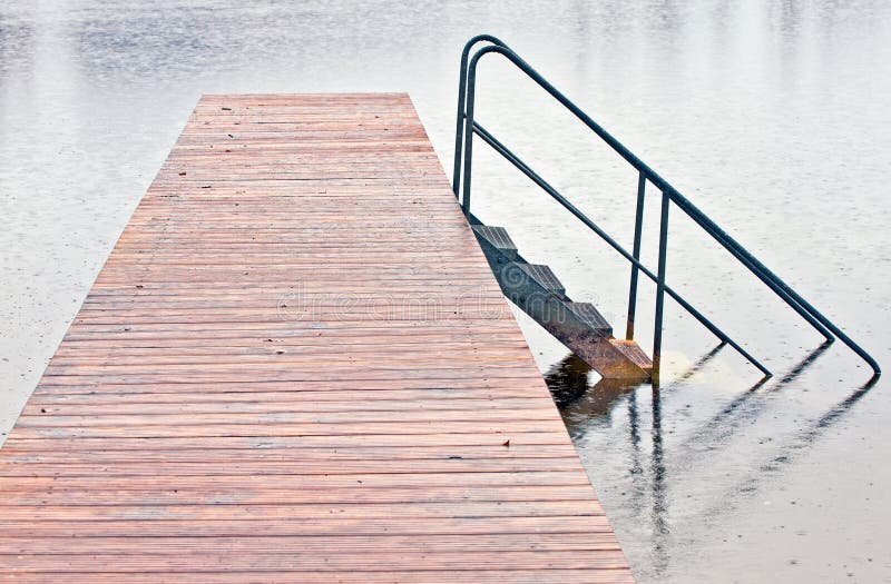 Wharf on lake in rain stock photo. Image of dreary, water - 11814612