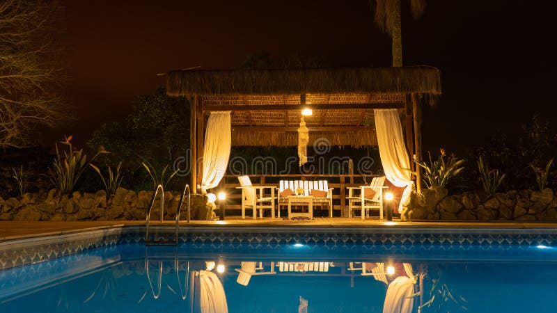 Fancy Bungalow by the Pool in a Cozy Night Stock Image - Image of light ...