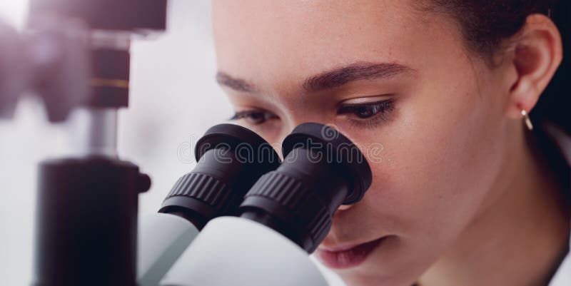What Do we Have Here. a Young Scientist Using a Microscope in a Lab ...