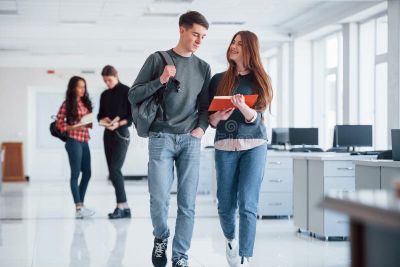 What Do You Think about it. Group of Young People Walking in the Office ...