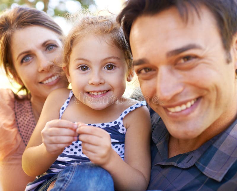 What a Happy Family. Portrait of a Young Family Enjoying the Outdoors ... What a Happy Family. Portrait of a Young Family Enjoying the Outdoors ...