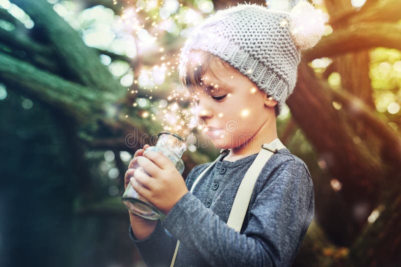 What Magic is this. a Little Boy Catching Fireflies in a Jar Outside ...