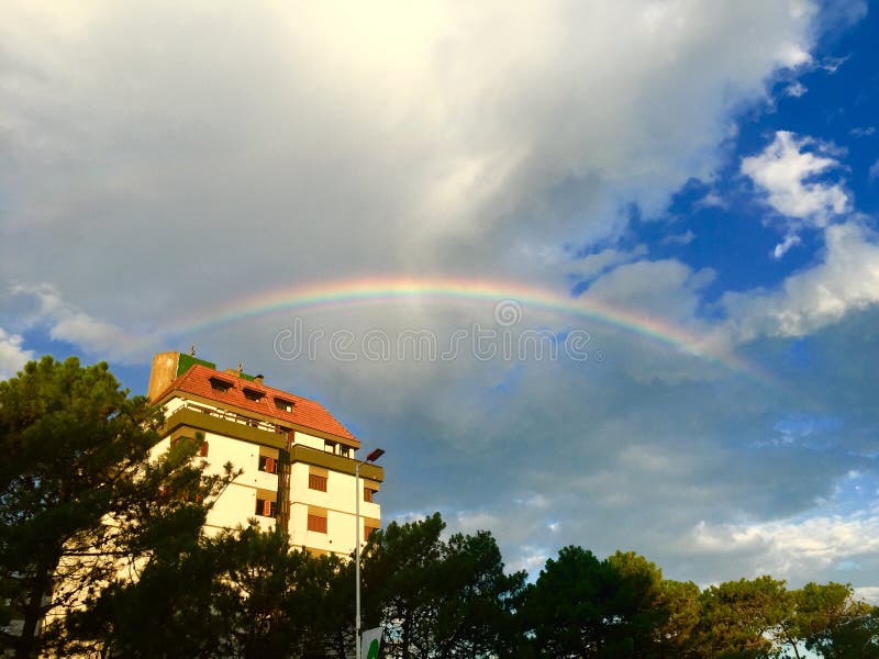 Perfect rainbow stock image. Image of clouds, trees - 117845435