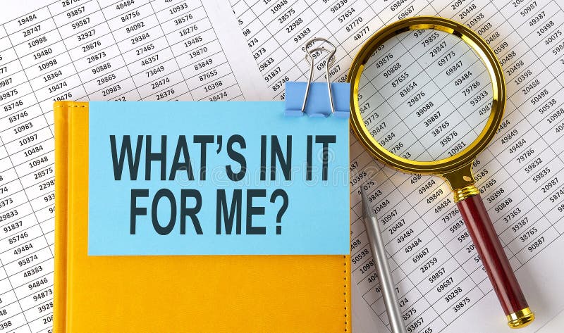 WHAT`S in it for ME Text on Sticker on Notebook with Magnifier and ...