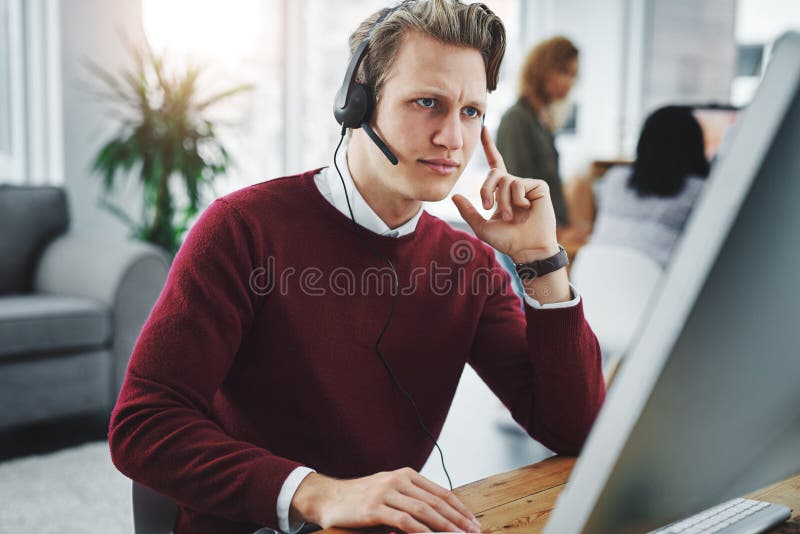 What Seems To Be the Problem. a Young Man Using a Headset and Computer ...