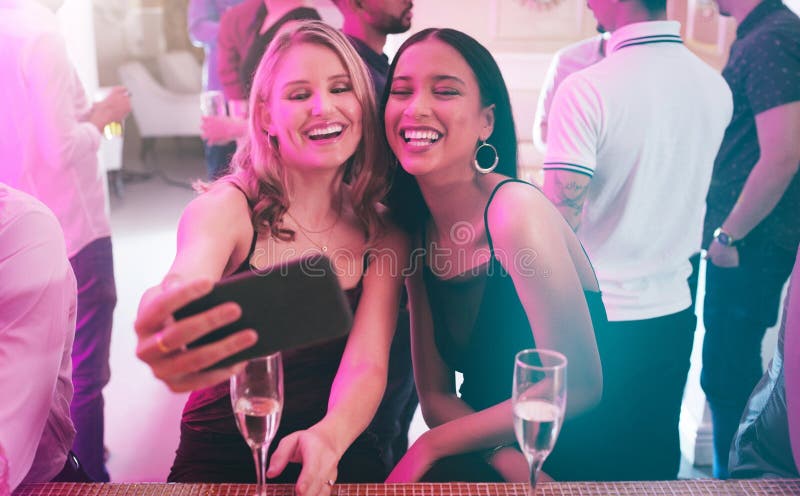 What Would A Party Be Without All The Selfies Two Young Women Taking A