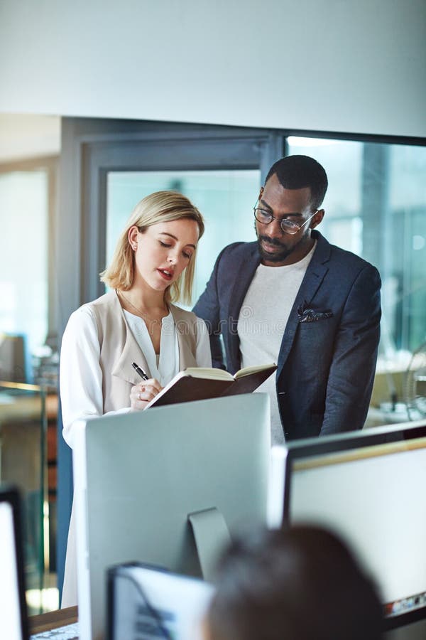 This is What Your Day is Looking Like so Far. Two Colleagues Using a ...