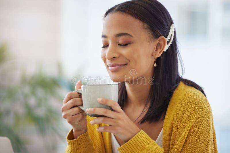 Whats a Day without Coffee. a Young Woman Drinking Coffee at Home ...