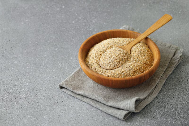 Wheat Bran in Bowl and in Spoon on Gray Table Stock Image - Image of ...