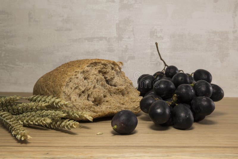 A Wheat Bread and Red Grapes Stock Photo - Image of cereals, beverage ...