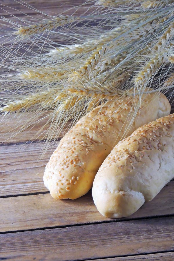 Wheat buns and spikelets stock image. Image of baked - 134693207