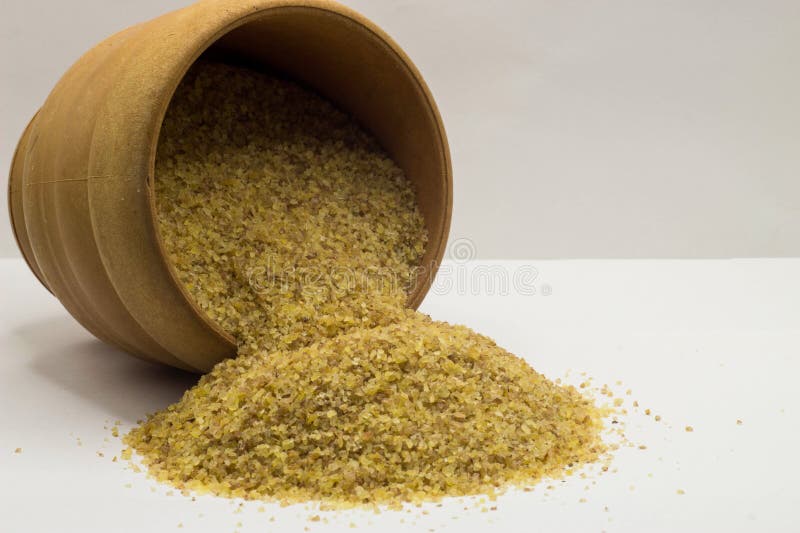 Wheat Cereal Poured into a Container, Wheat Groats Scattered in a Heap ...