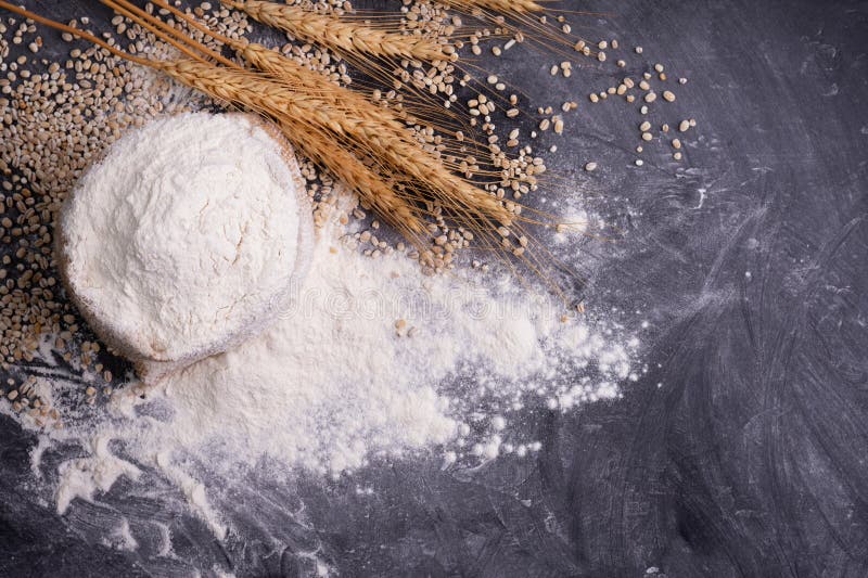 Wheat Flour in Sacks with Wheat Ears on the Table, Black Background ...