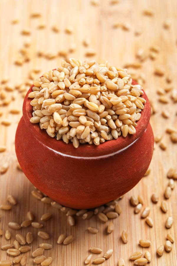 Wheat Grains in Clay Pot on White Background Stock Image - Image of ...