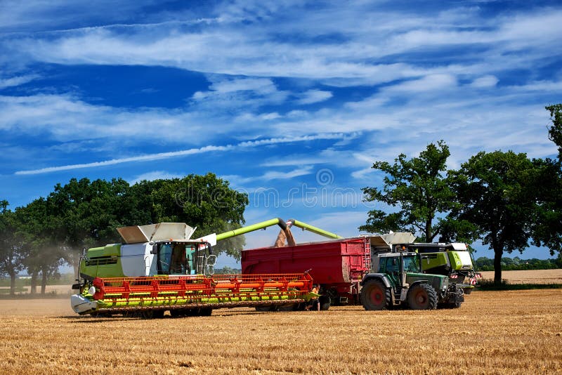 Wheat Harvester Machine at Work on Field Stock Photo - Image of golden ...