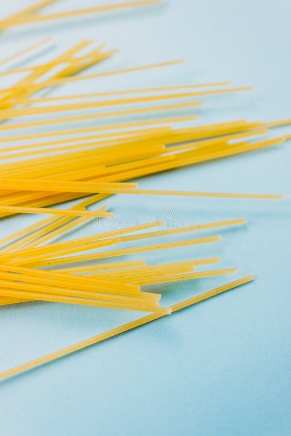 Wheat Pasta Spaghetti Isolated on a Blue Background. Stock Photo ...