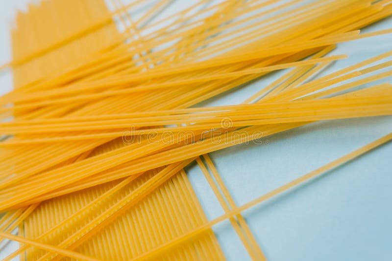 Wheat Pasta Spaghetti Isolated on a Blue Background. Stock Photo ...