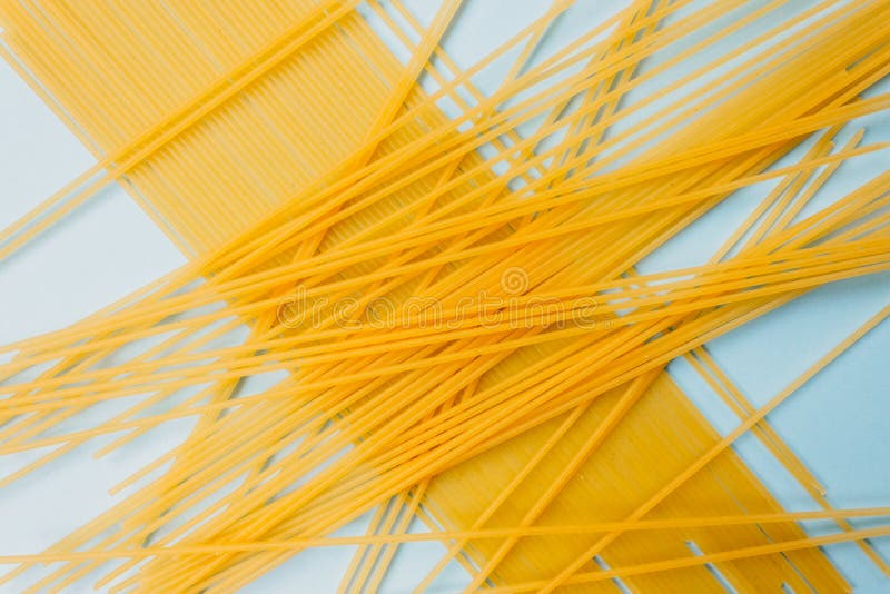 Wheat Pasta Spaghetti Isolated on a Blue Background. Stock Photo ...