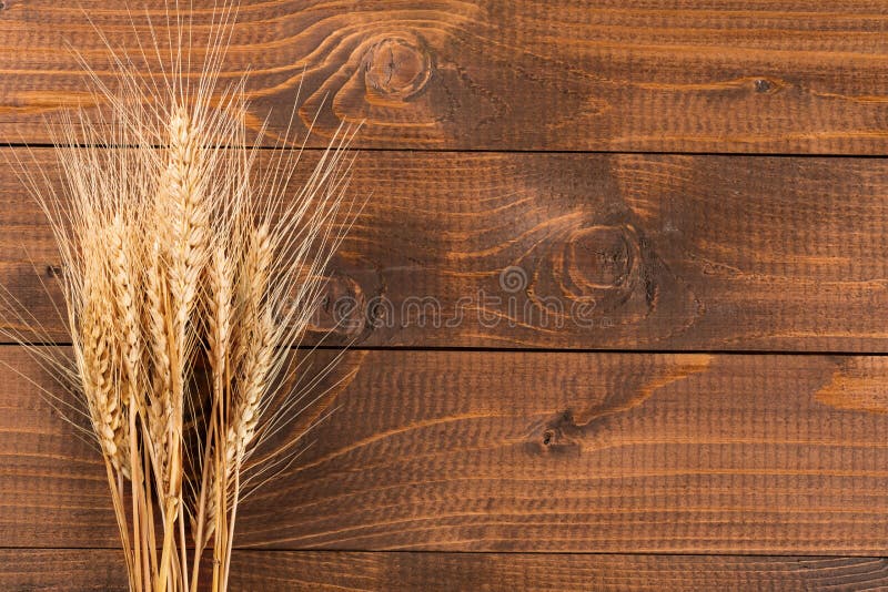 Wheat on wooden background stock photo. Image of farming - 57379320