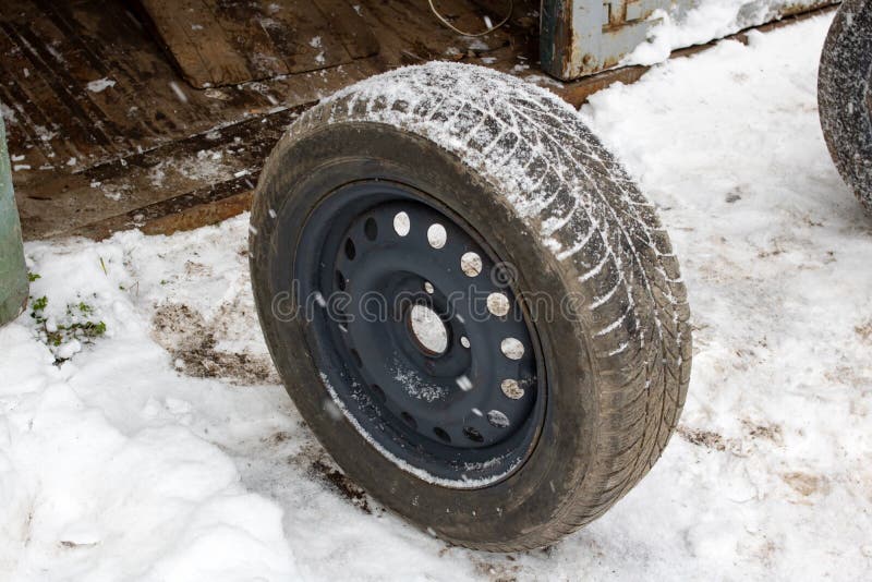 The Wheel for the Car is on the Snow Stock Photo - Image of seasonal ...