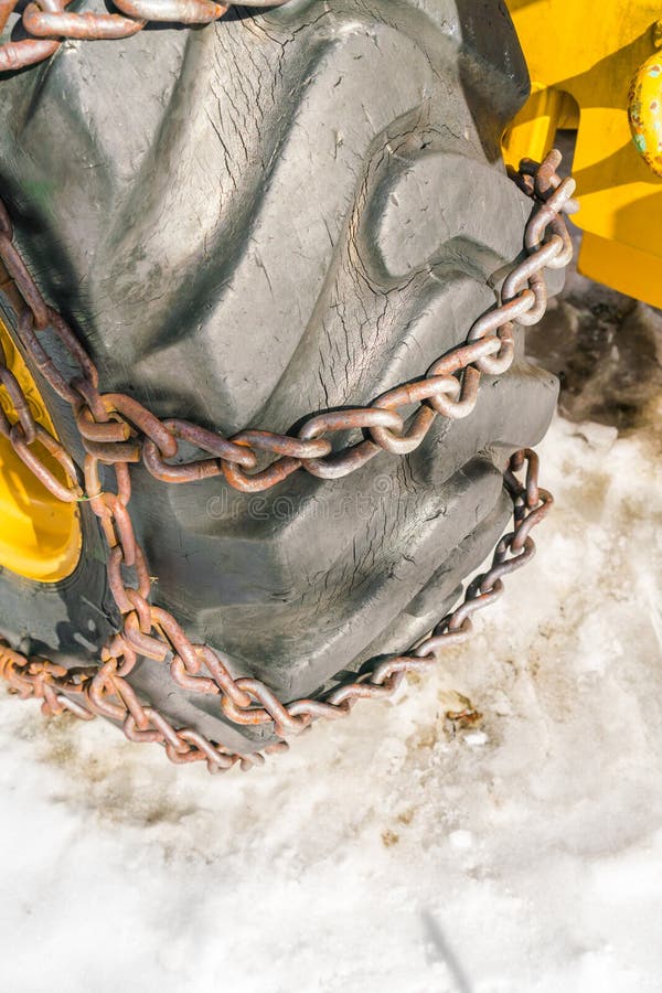 Wheel with chains on snow. stock image. Image of climate - 71796585