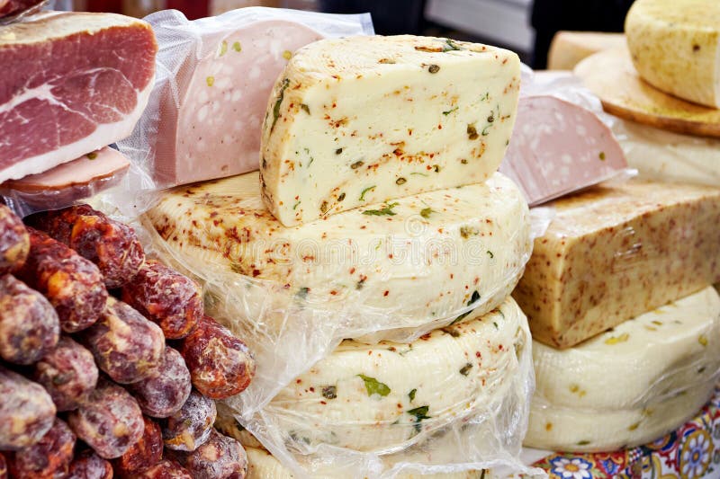 Wheel of Cheese Spices in Market Stock Photo - Image of display ...