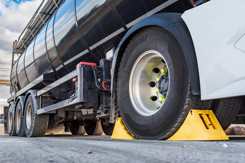 Wheel Chocks Placed on the Drive Wheel of a Tanker Truck To Immobilize ...